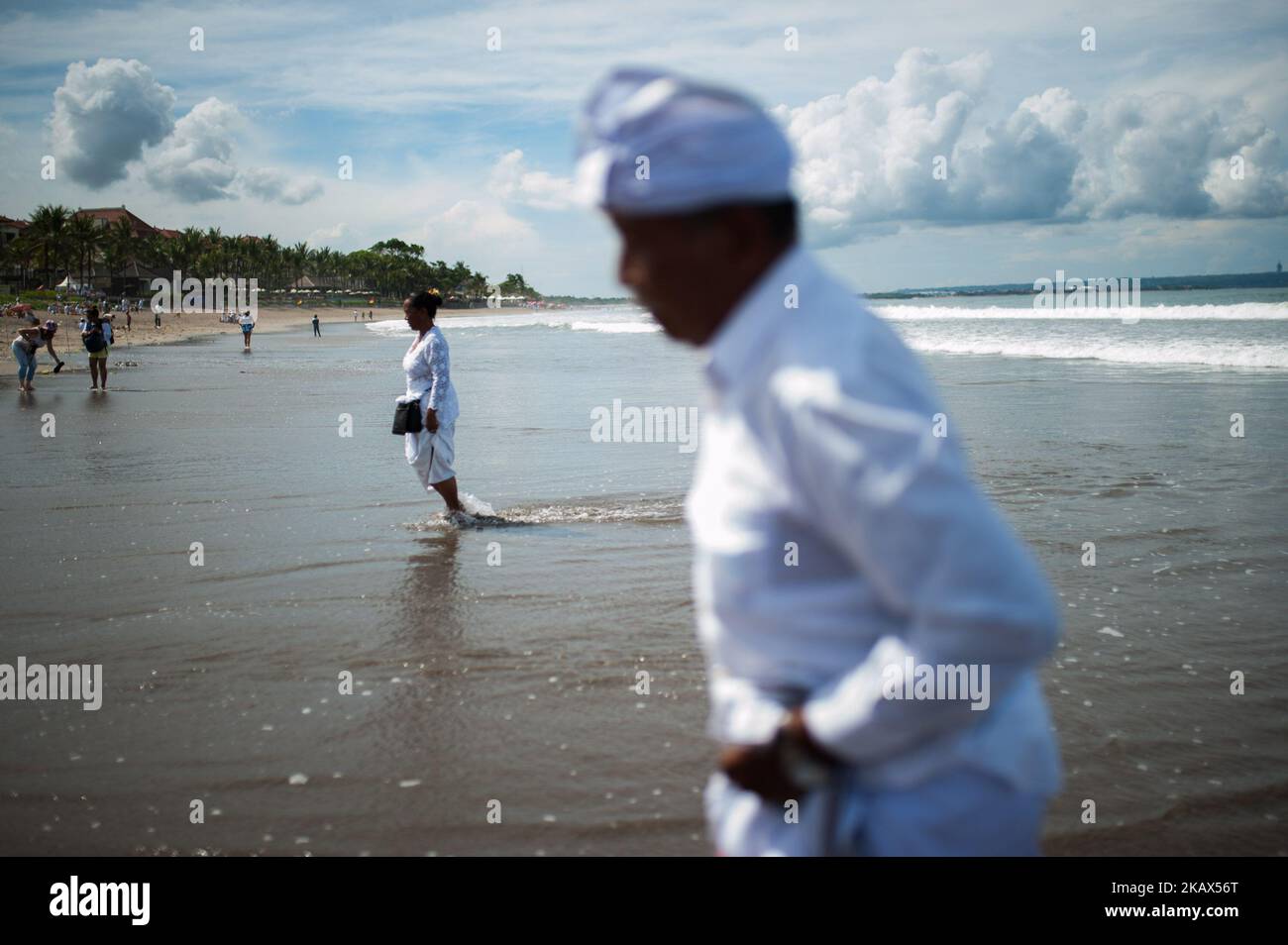 Balinese Hindus are conducting prayers at Petitenget beach on March 14 ...
