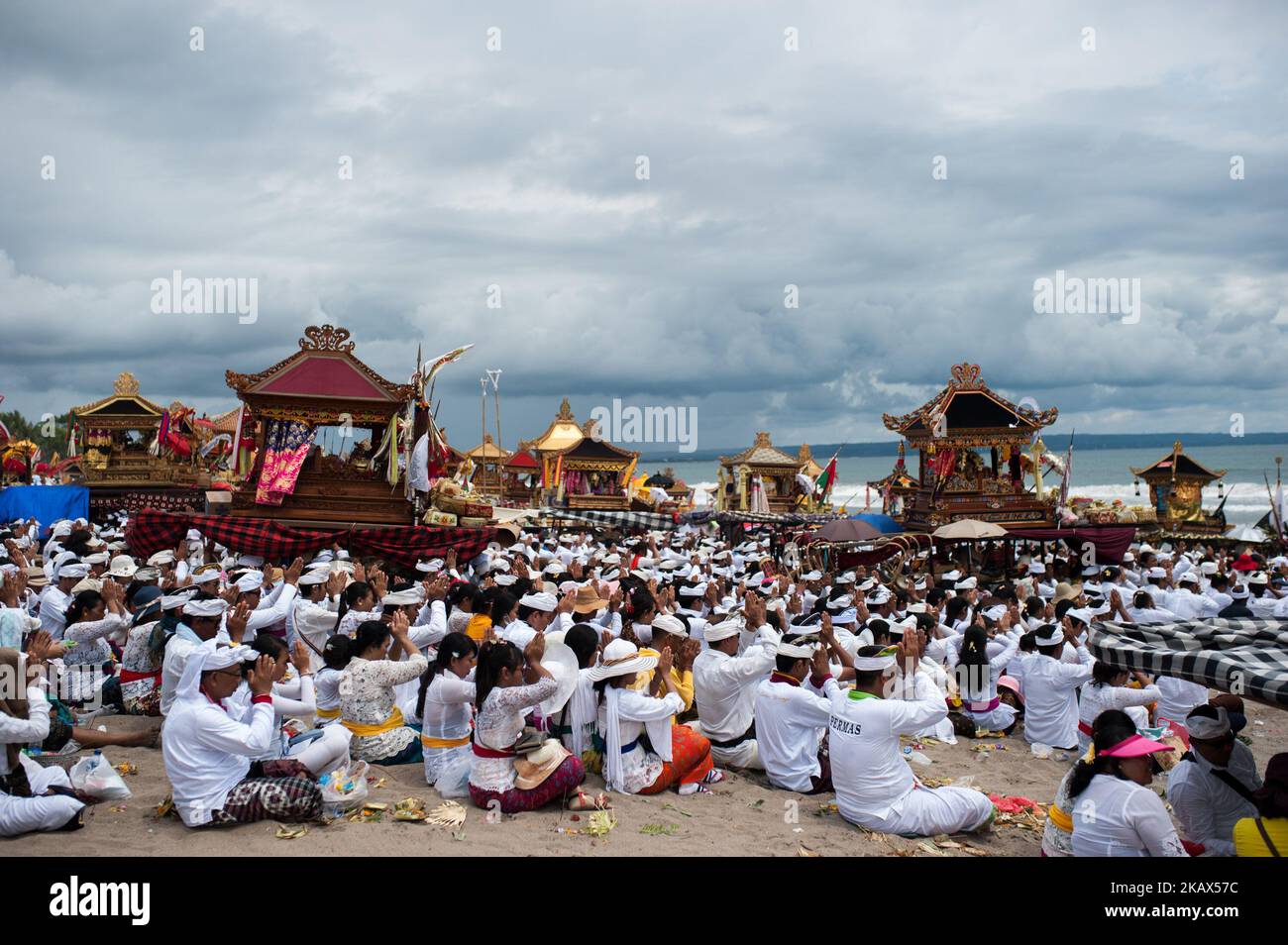 Balinese Hindus are conducting prayers at Petitenget beach on March 14 ...