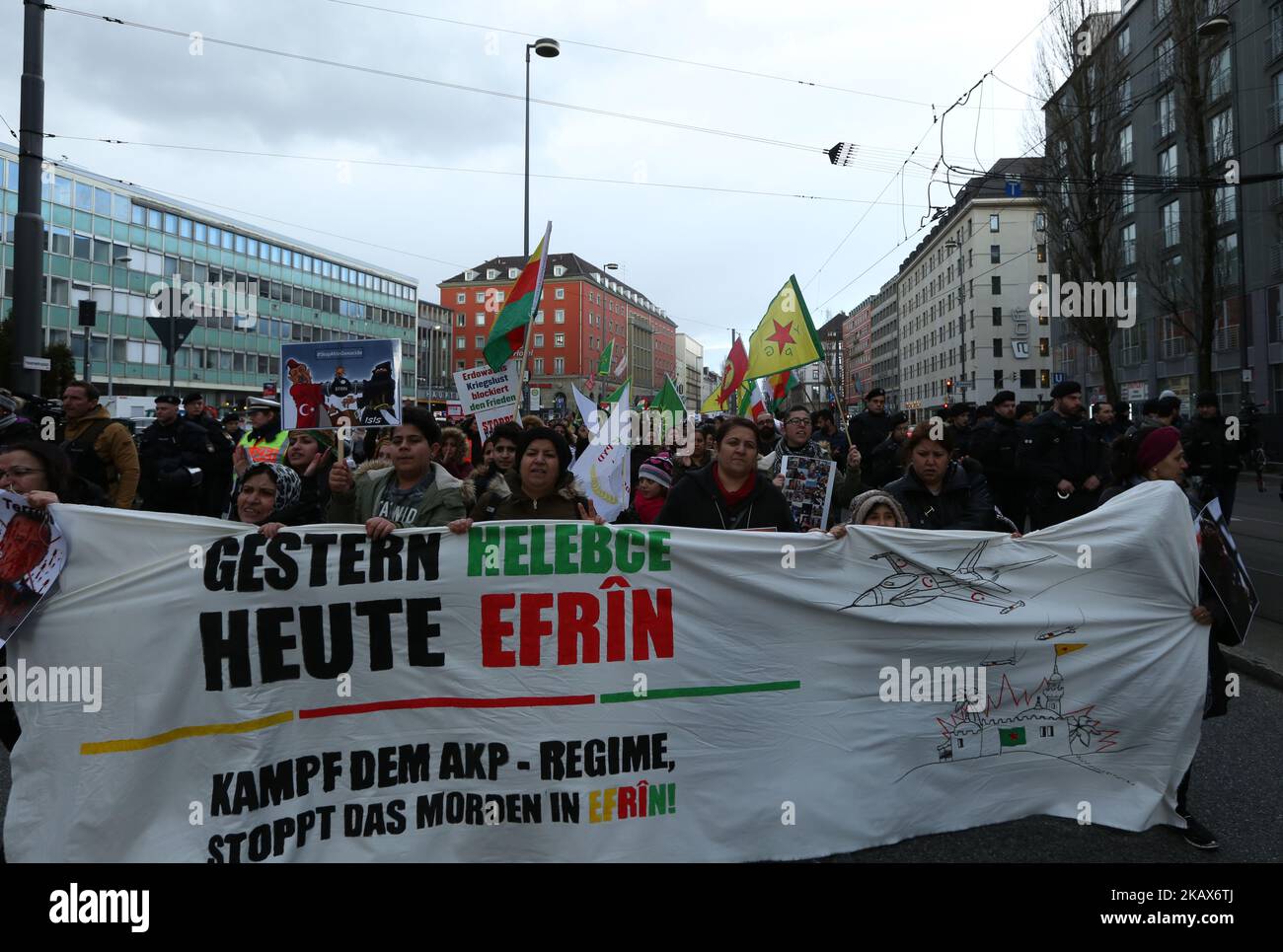 Protestors show flags of Rojava, YPG and YPJ. Hundreds of people ...