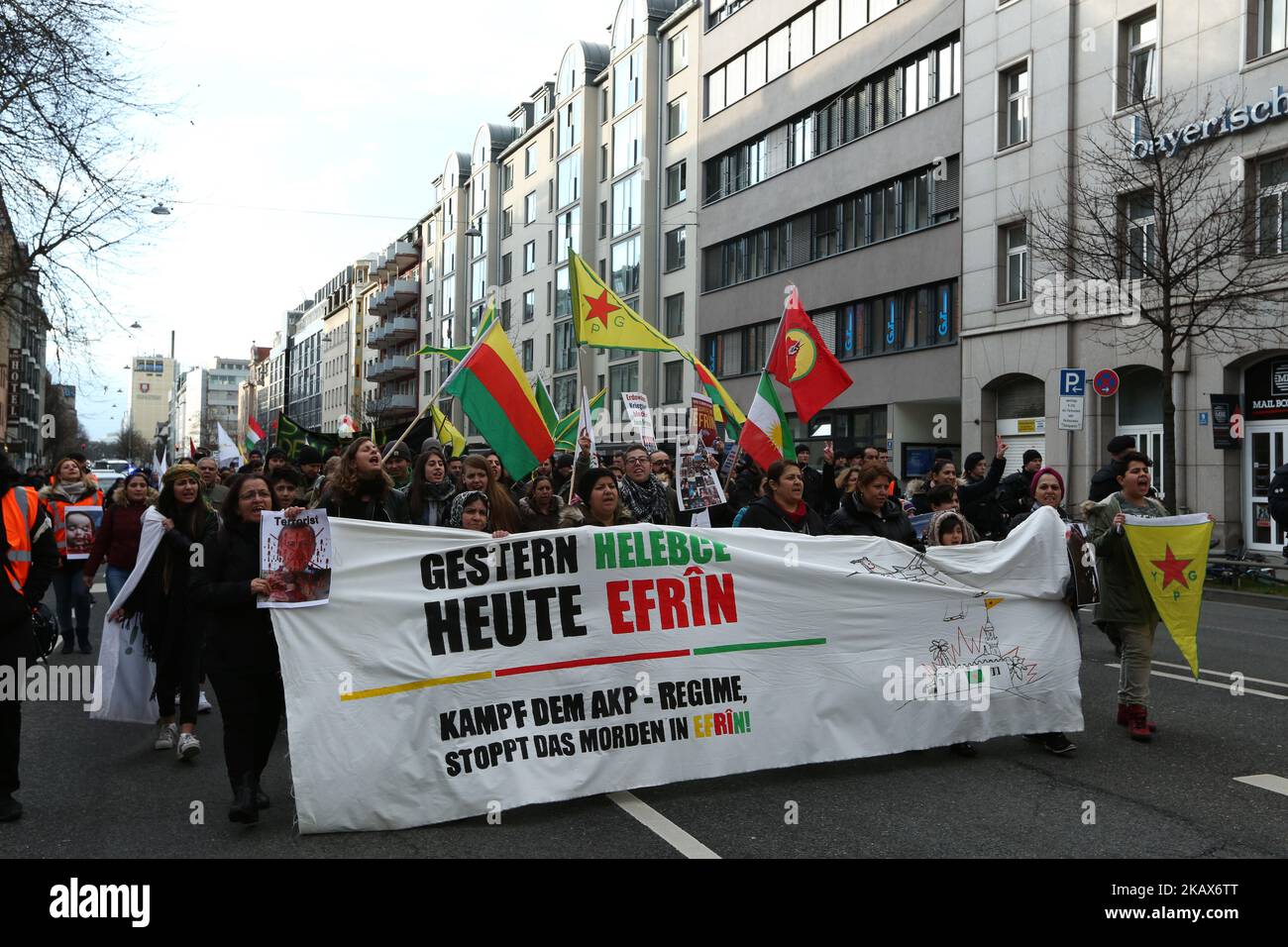Protestors show flags of Rojava, YPG and YPJ. Hundreds of people ...