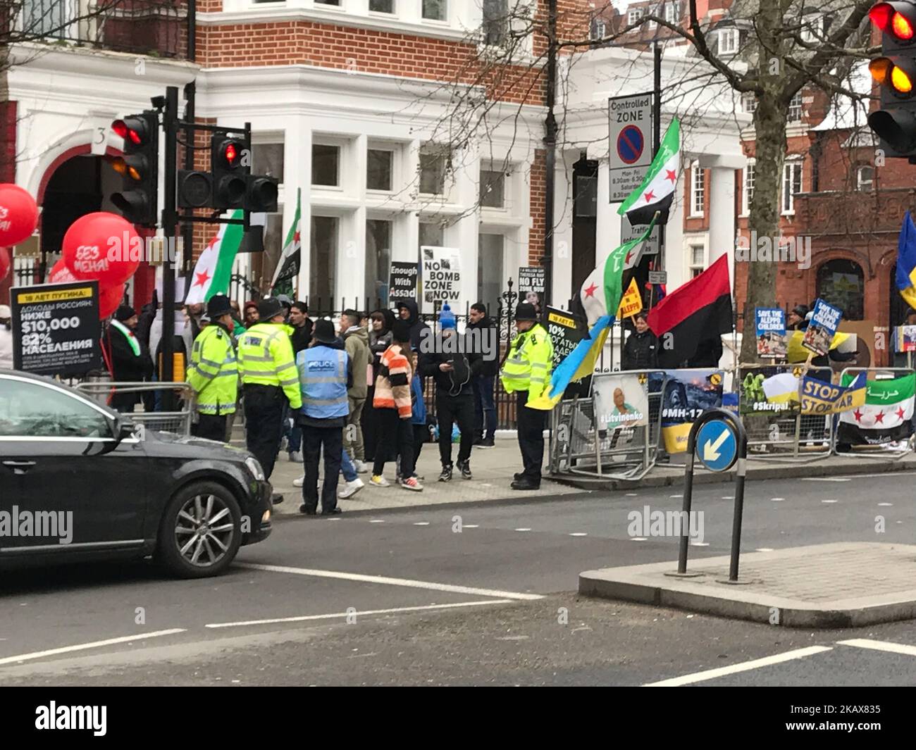 People protest the Russian election in London by demonstrating opposite ...