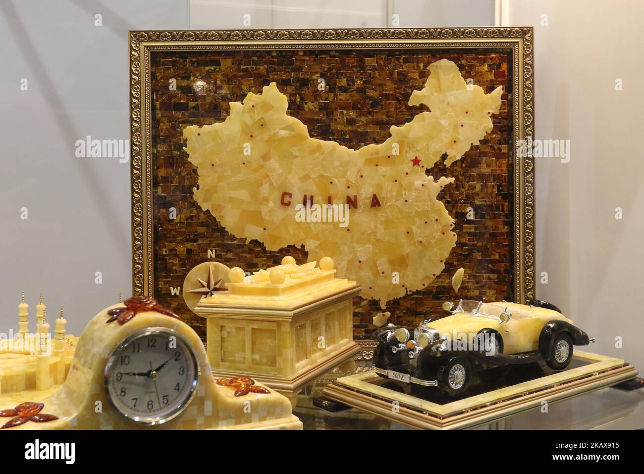Retro car in front of map of China all made of amber is seen in Gdansk ...