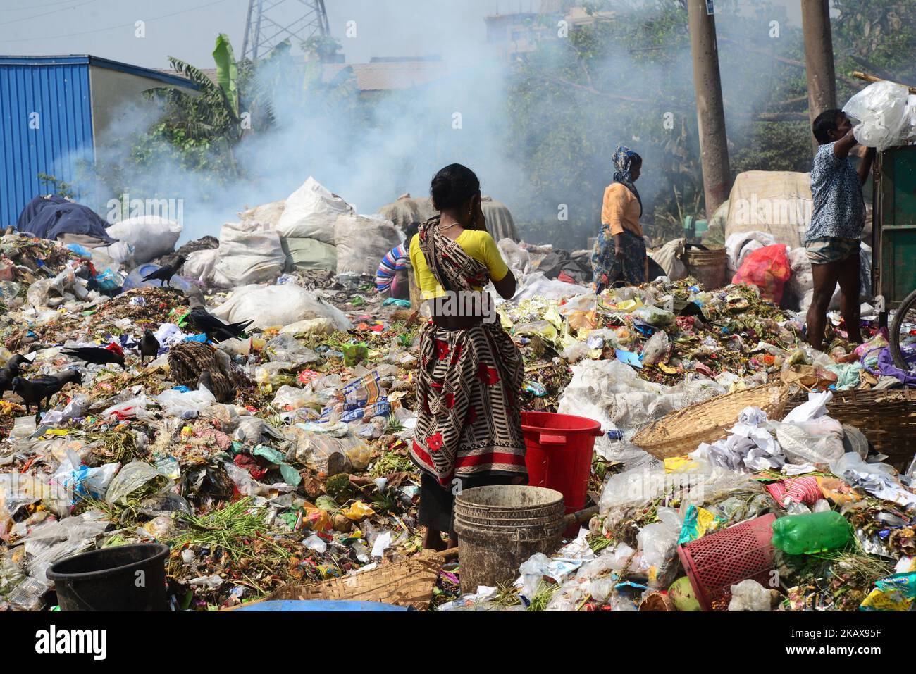 Bangladeshi people waste picker picks the non- biodegradable waste to ...