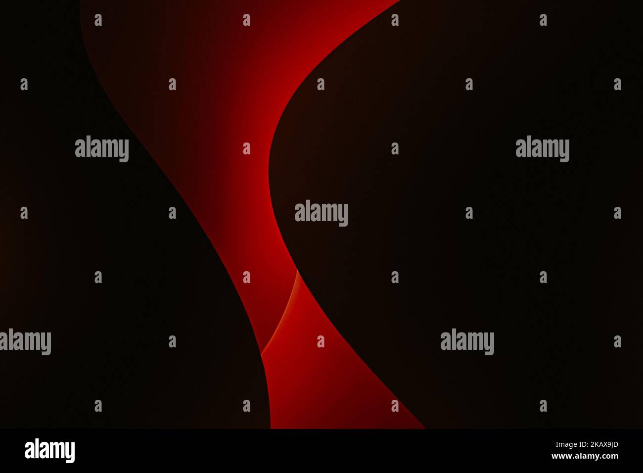 A digital render of an abstract futuristic flowing black red background ...