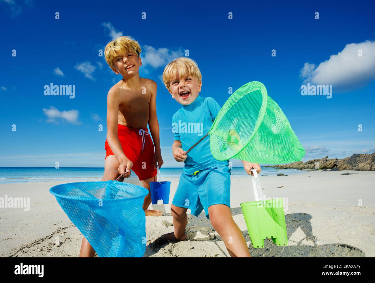 Child catching butterfly hi-res stock photography and images - Alamy