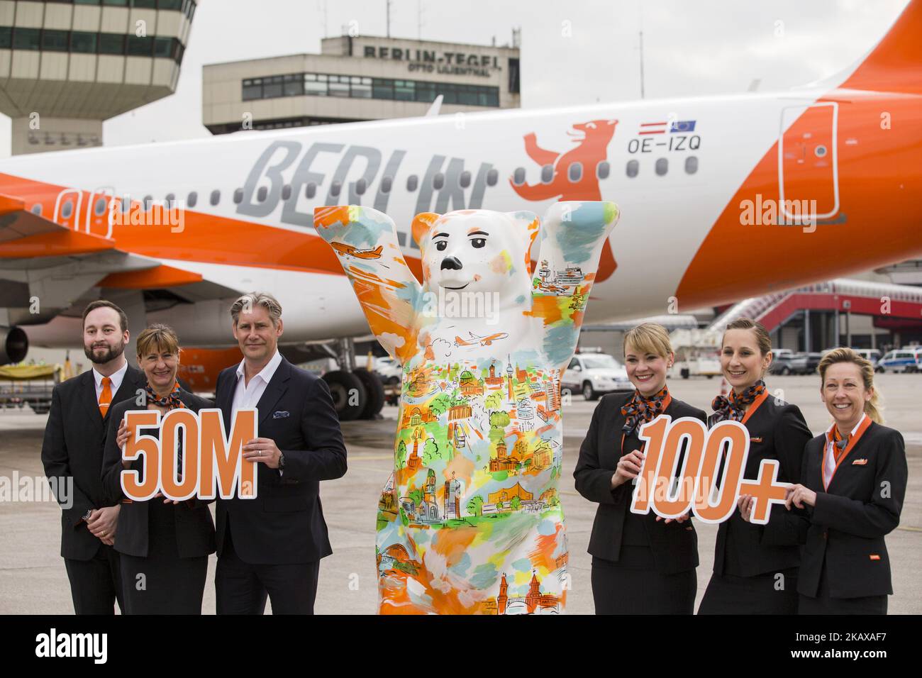 Easyjet-CEO Johan Lundgren (3L) and a cabin crew pose for a picture in ...