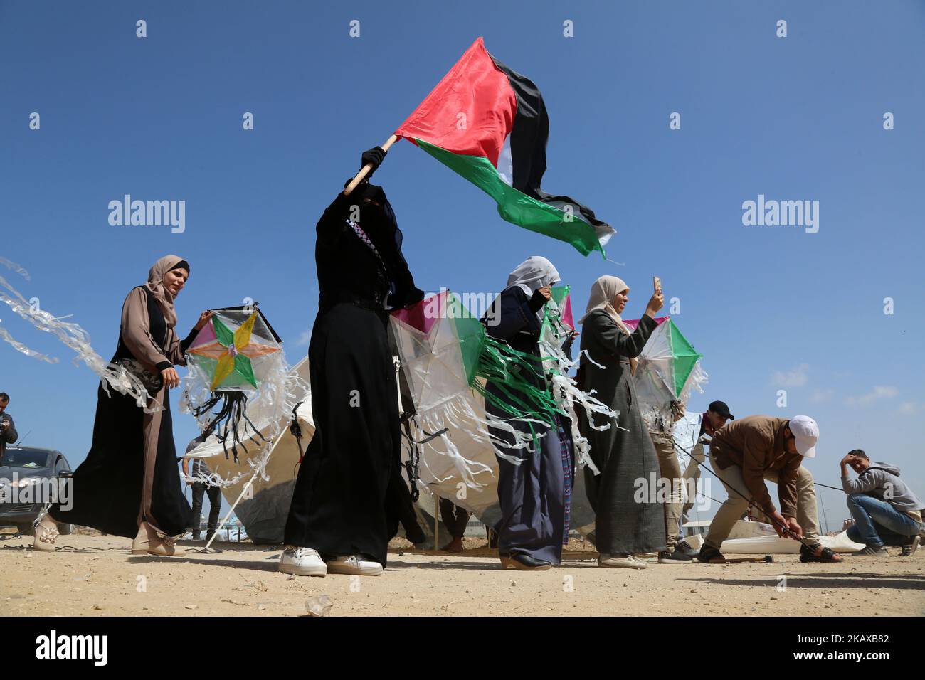 Palestinian fly kites marked with the colours of the Palestinian flag ...