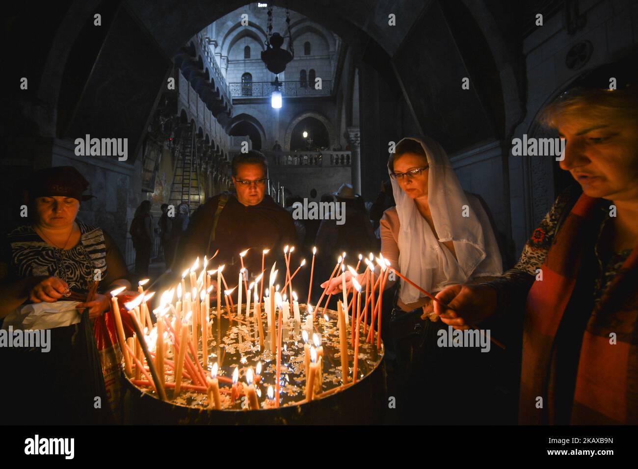 Christians Orthodox pray inside the Holy Sepulchre church in the Old ...