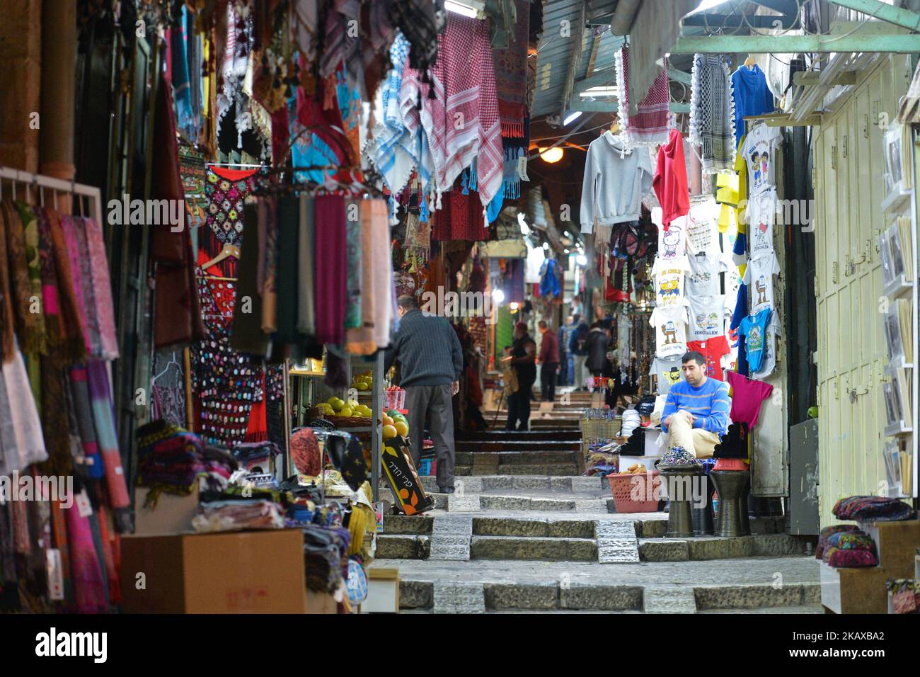 A view of a street with shops selling souvenirs and memorabilia inside ...