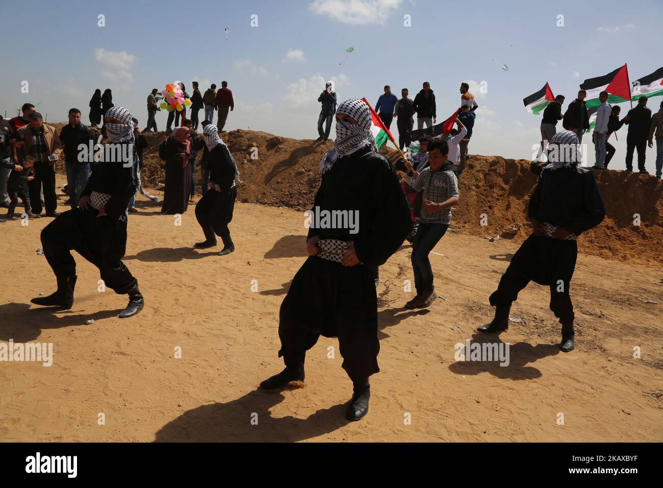 Palestinian men dance the "Dabka" next to tents pitched by Palestinians ...