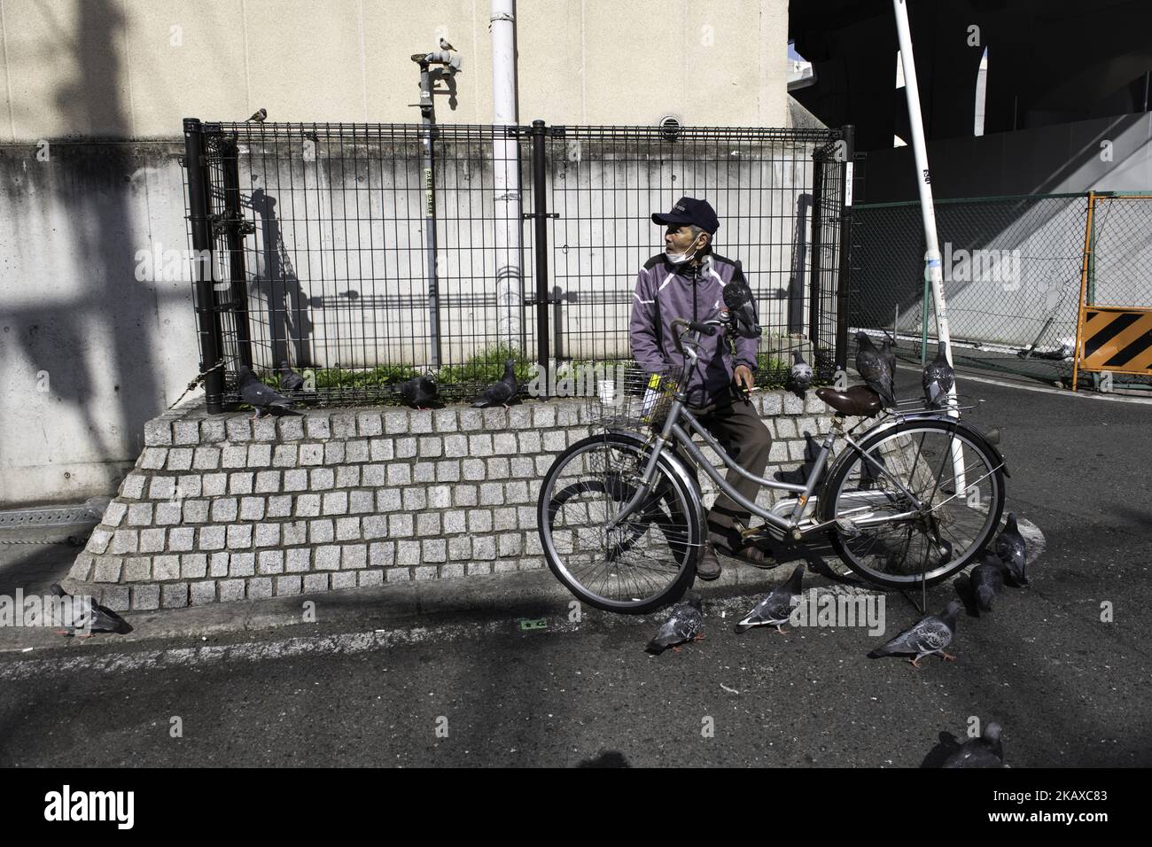 OSAKA, JAPAN - MARCH 31: OSAKA, JAPAN - MARCH 31: A homeless man stand ...