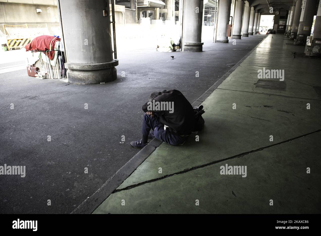 OSAKA, JAPAN - MARCH 31: Homeless man take a rest around Airin in ...
