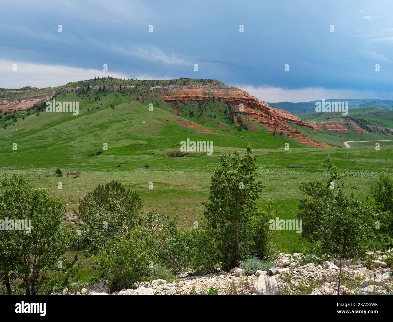Red sandstone cliff and rolling grassy plains from the Chief Joseph ...