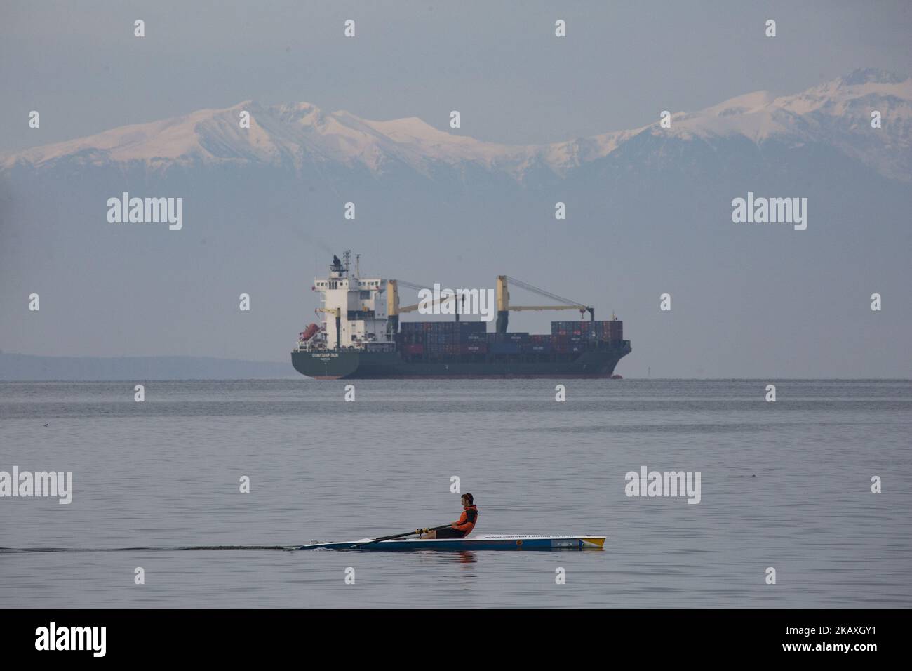 Freighter ships as seen in Thessaloniki city in Greece, having one of ...