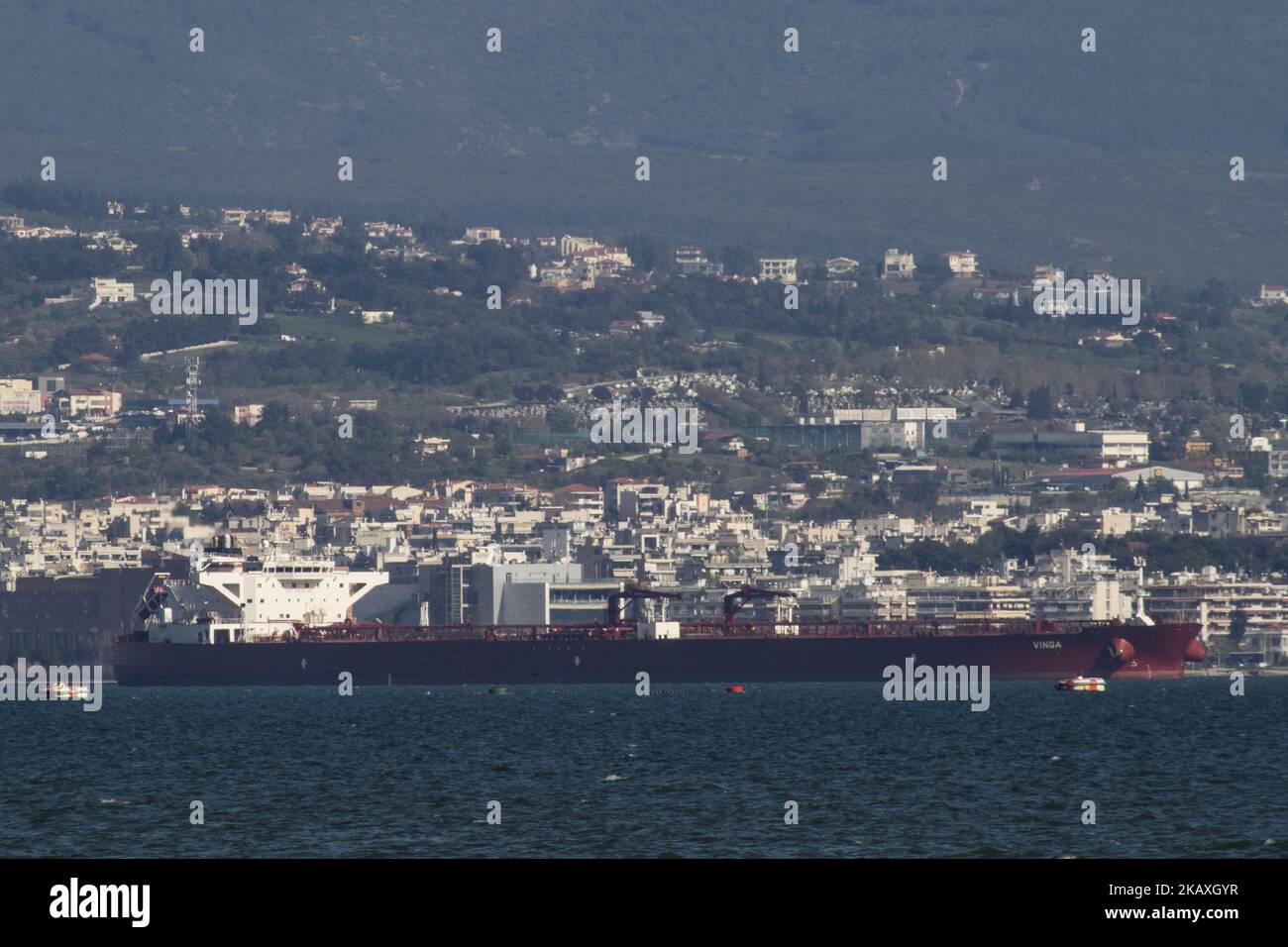 Freighter ships as seen in Thessaloniki city in Greece, having one of ...