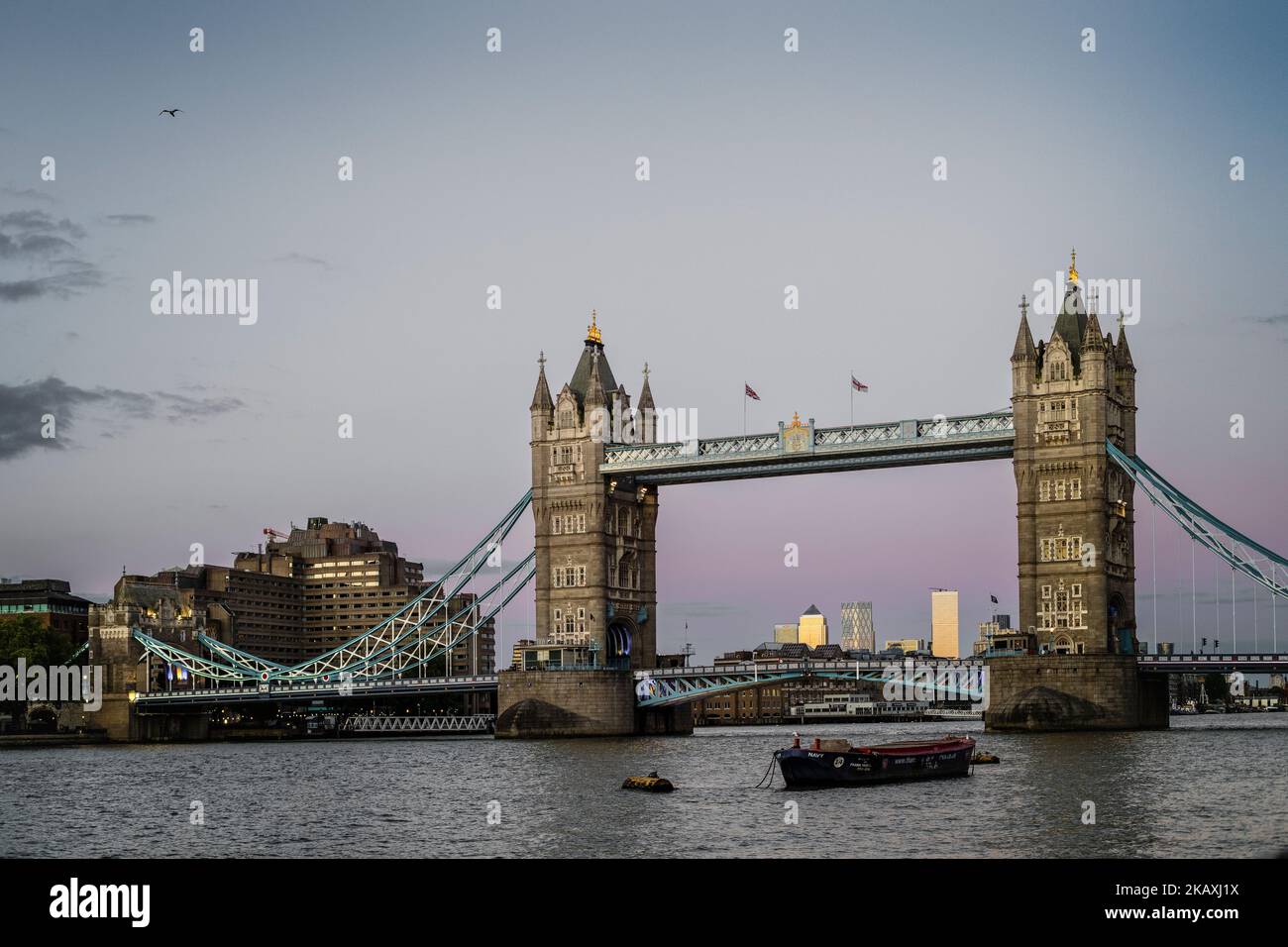 Dusk in London looking towards Canary Wharf high tide barge in the ...