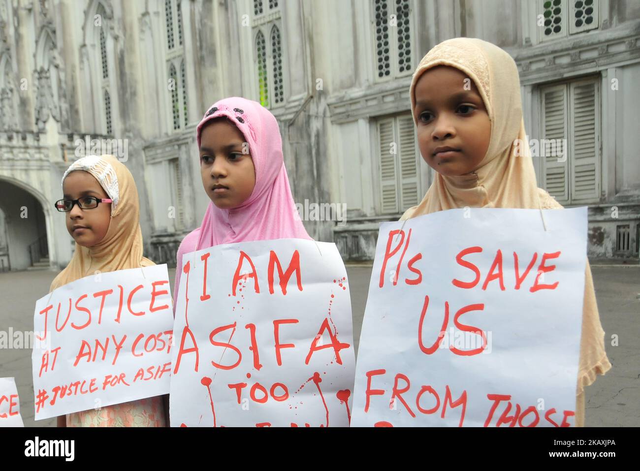 Indian students participate in a candle light vigil as they protest ...