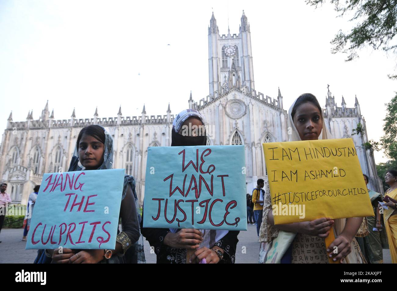 Indian Students participate in a candle light vigil as they protest ...