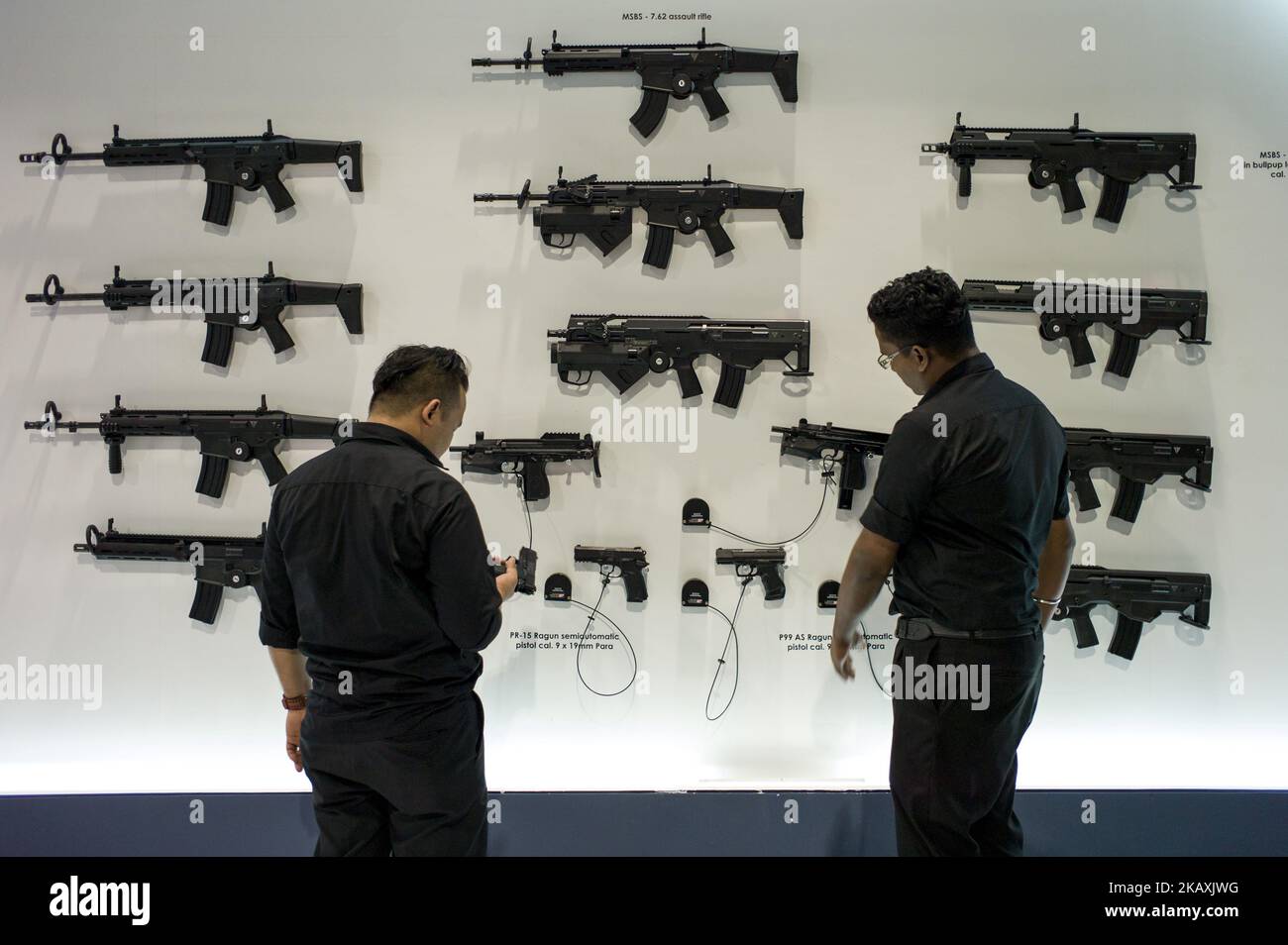 Machine guns and pistols are seen at exhibition booth of Ministry of ...
