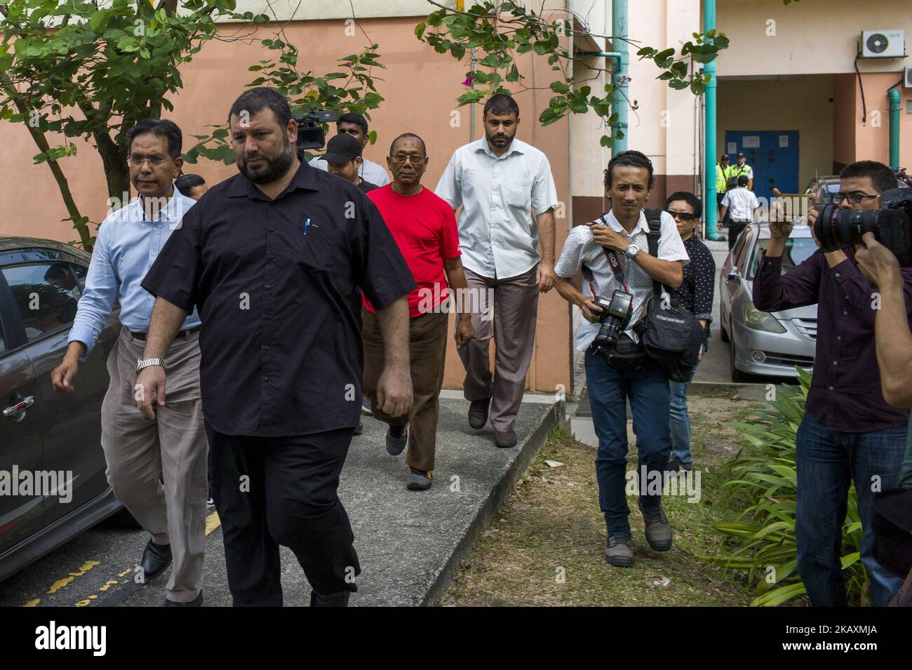 Friends(L) of Palestinian professor Fadi Mohammad al-Batsh who was ...