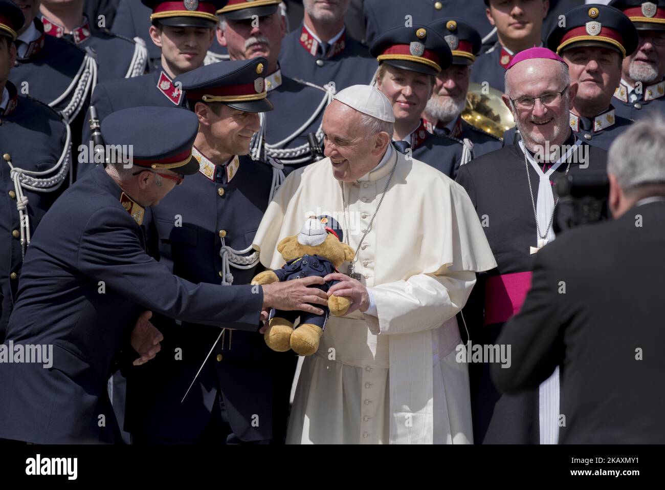 Pope Francis is presented with a teddy Bear ad he meets the band of ...