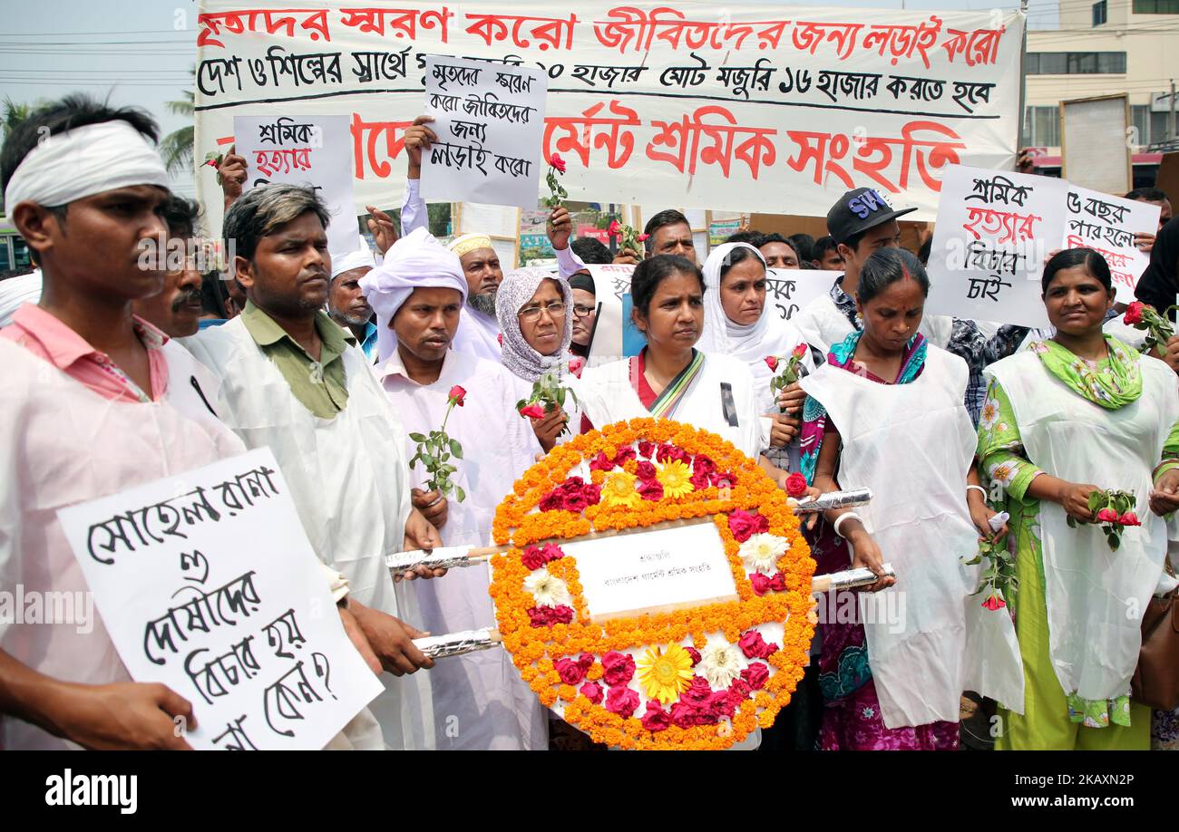 Floral wreath placed at the base of the hammer and scythe monument in ...