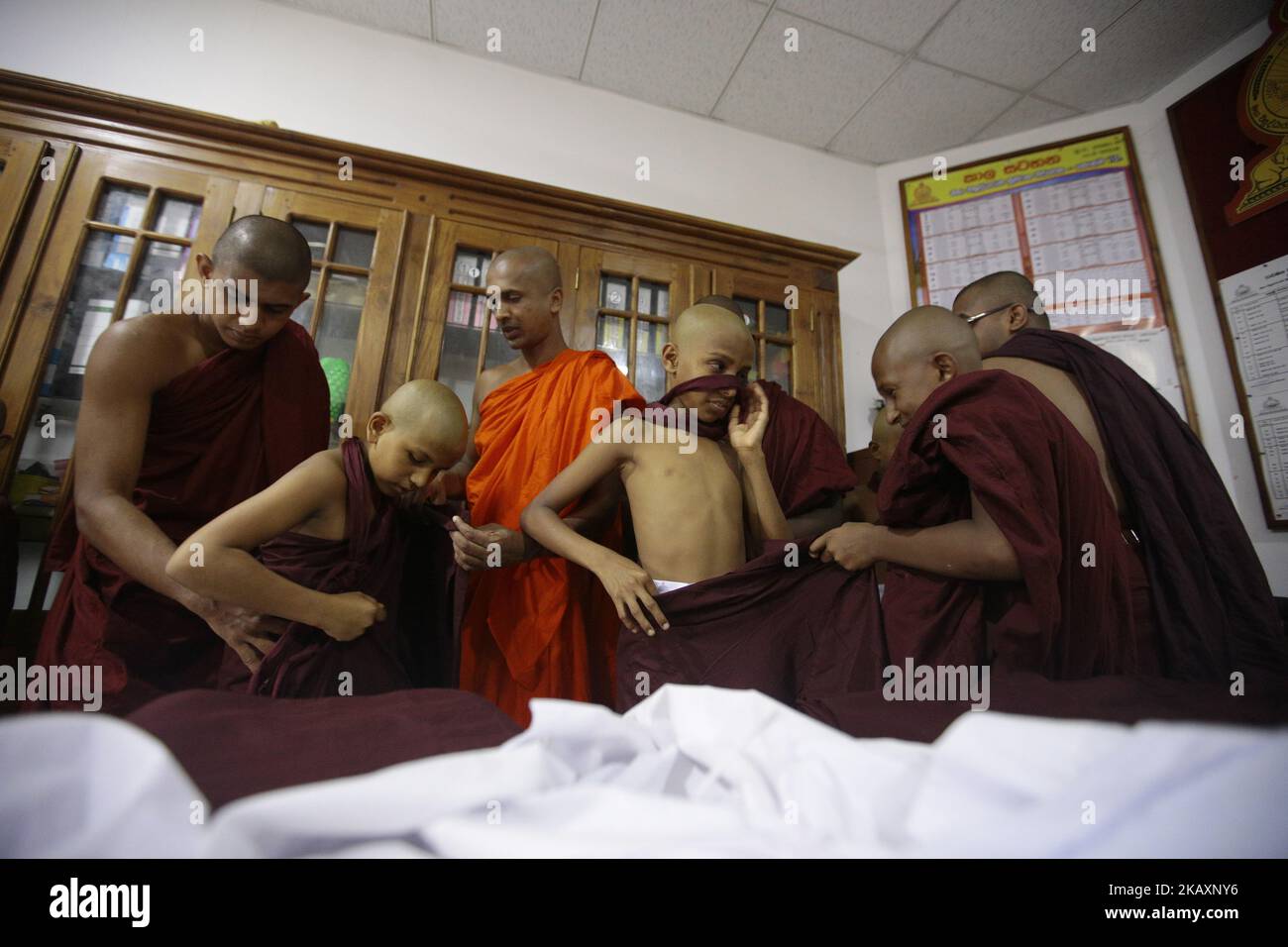 Newly joined Sri Lankan Novice Buddhist monks get dressed in maroon ...