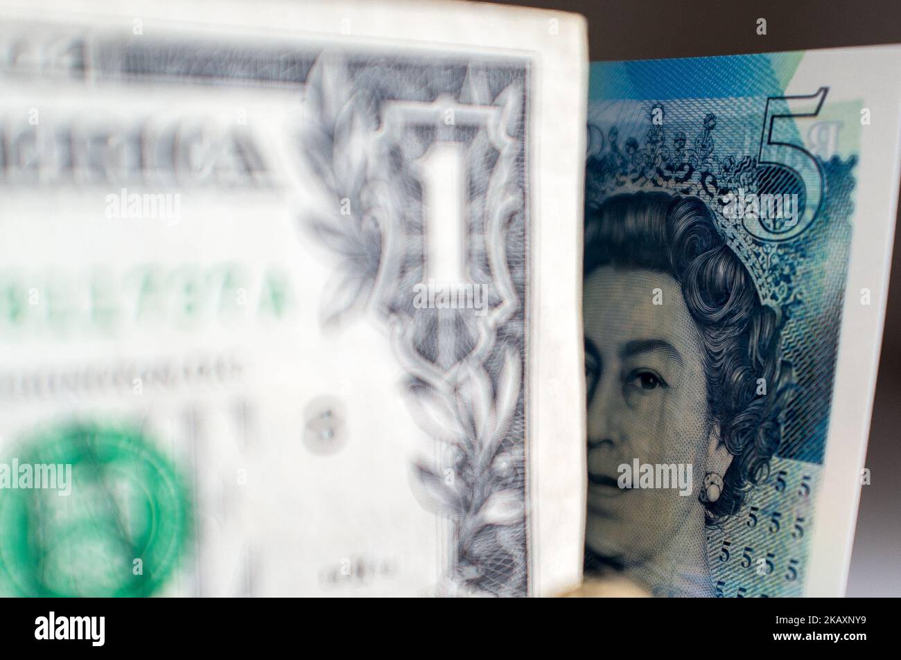 U.S. dollar and British Pound bank notes and are photographed in London ...