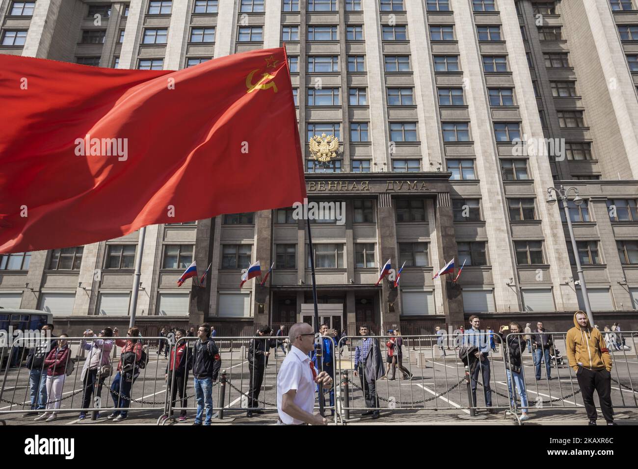 Participant with the old USSR flag passes in front of the Duma ...
