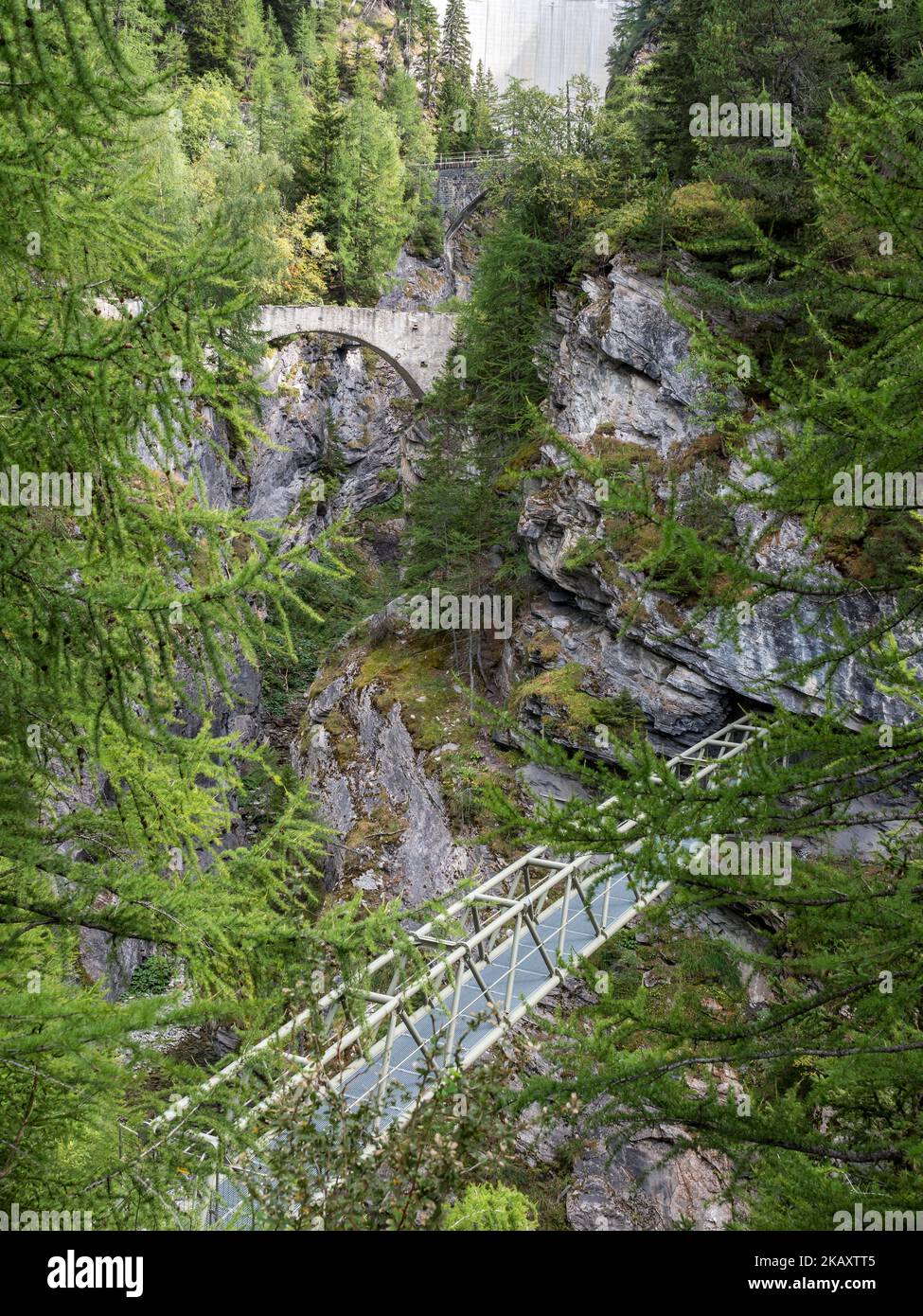 Historic bridge over narrow gorge just below water dam Barrage de ...