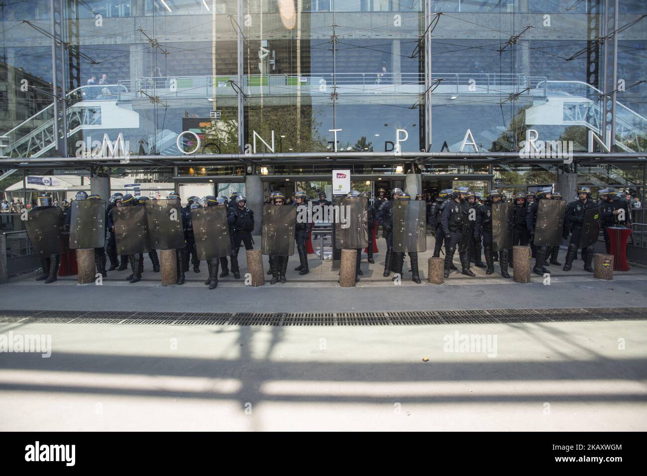 The French police block the entrance of the Montparnasse train station ...