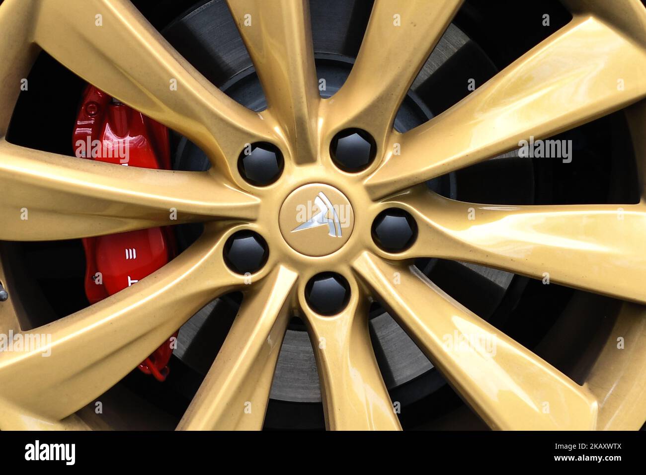 A Tesla logo on the wheel of a Tesla Model S P100D car at a launch ...