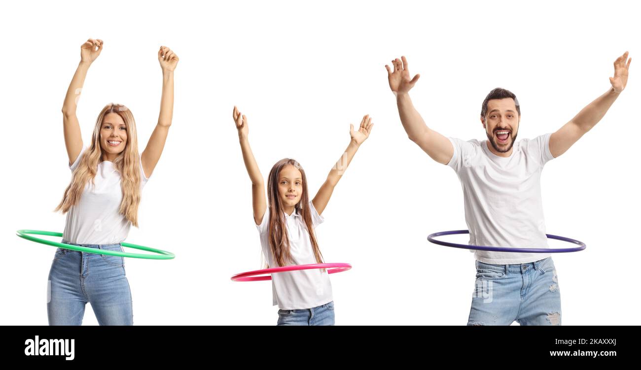 Mother, father and daughter spinning hula hoops isolated on white ...