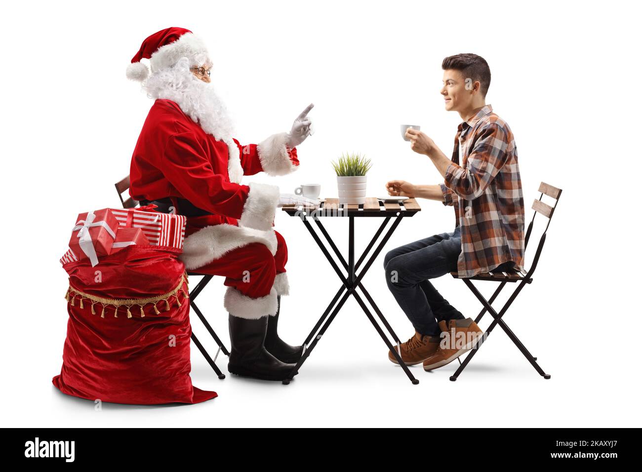 Santa Claus talking to a guy drinking a cup of coffee at a cafe ...