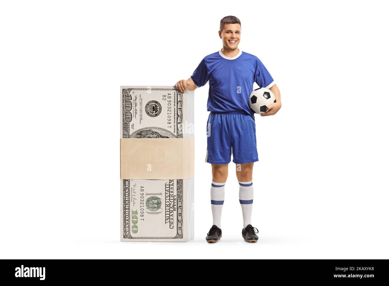 Man in a football jersey standing next to a big stack of money isolated ...