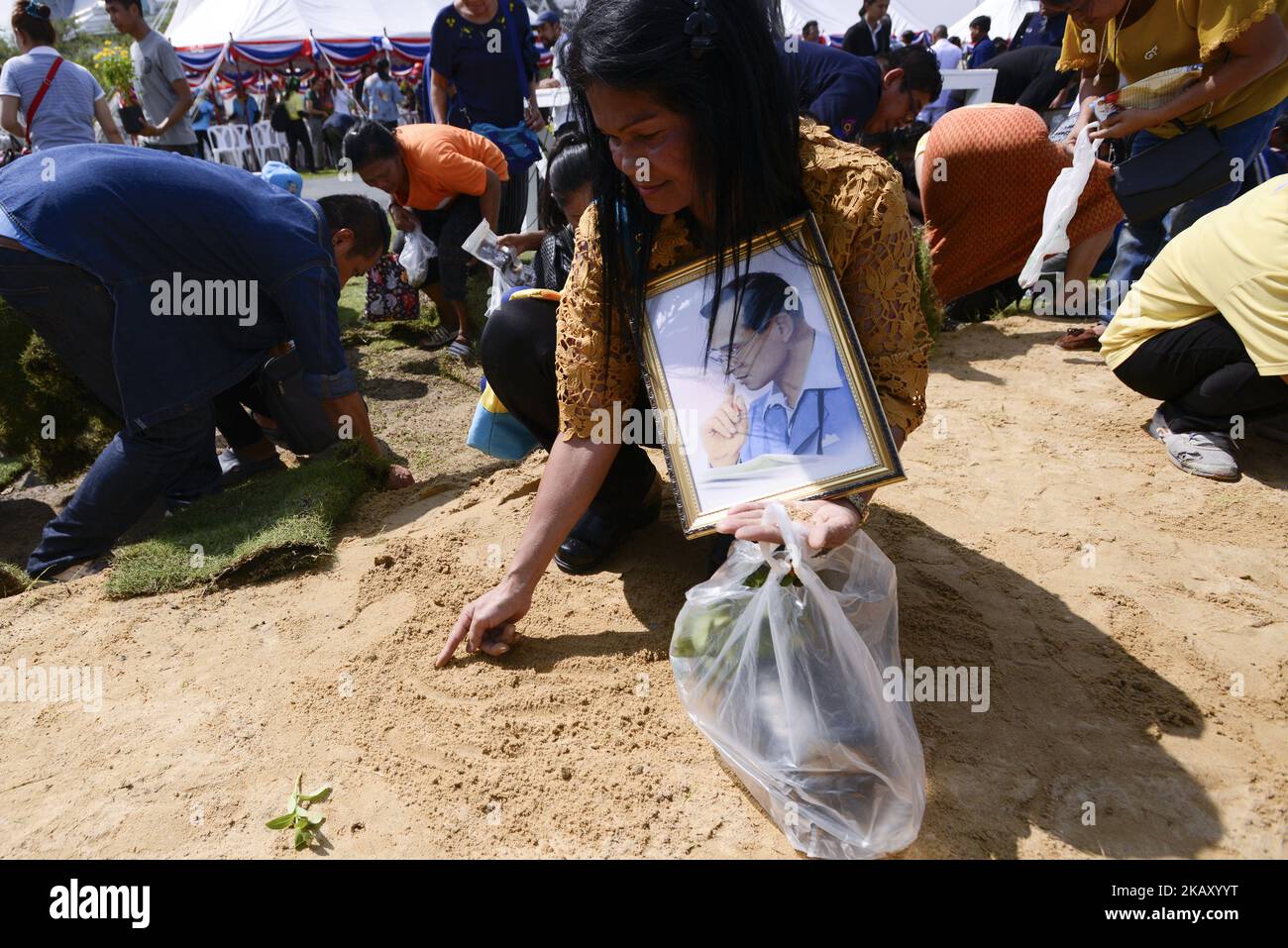 Attendees run to collect 'sacred' rice grains from the ground after the ...
