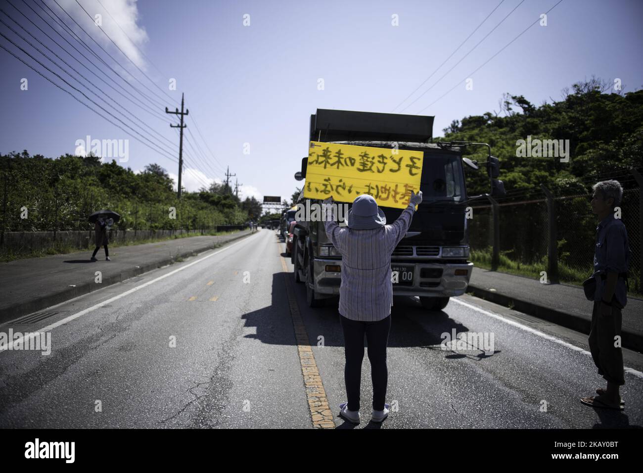 A woman protester block construction vehicles from entering the ...