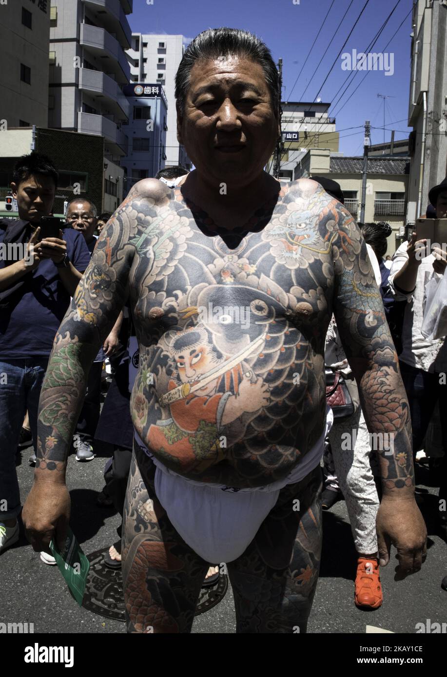 A heavily tattooed Japanese man pose for photo during Tokyo's one of ...