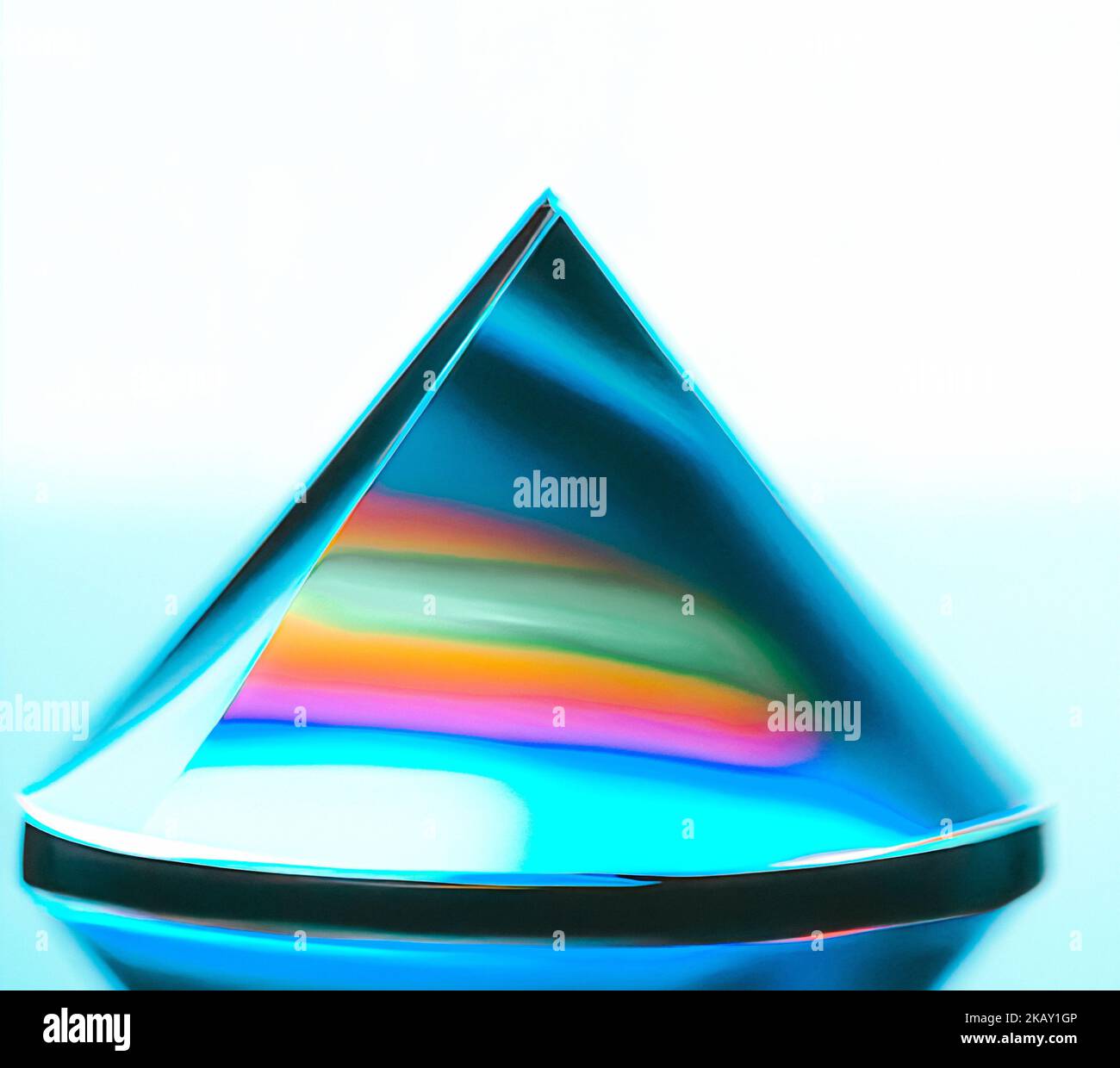 A closeup of a chrome triangle with the reflection of blue lights Stock ...