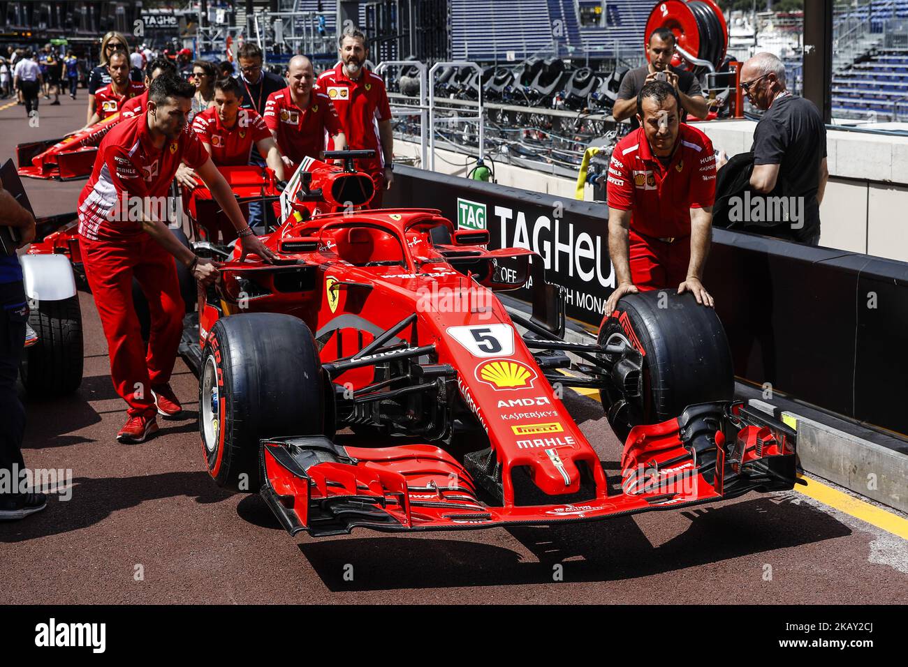 Ferrari mechanics pushing the 05 Sebastian Vettel from Germany with ...