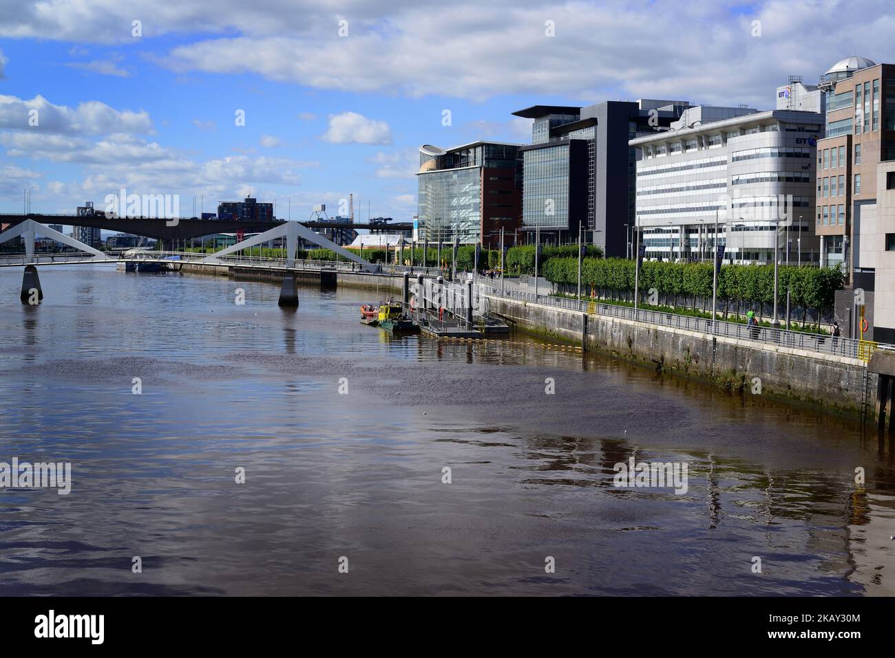 A scenic view of Clyde river with modern shoreline buildings, Glasgow ...