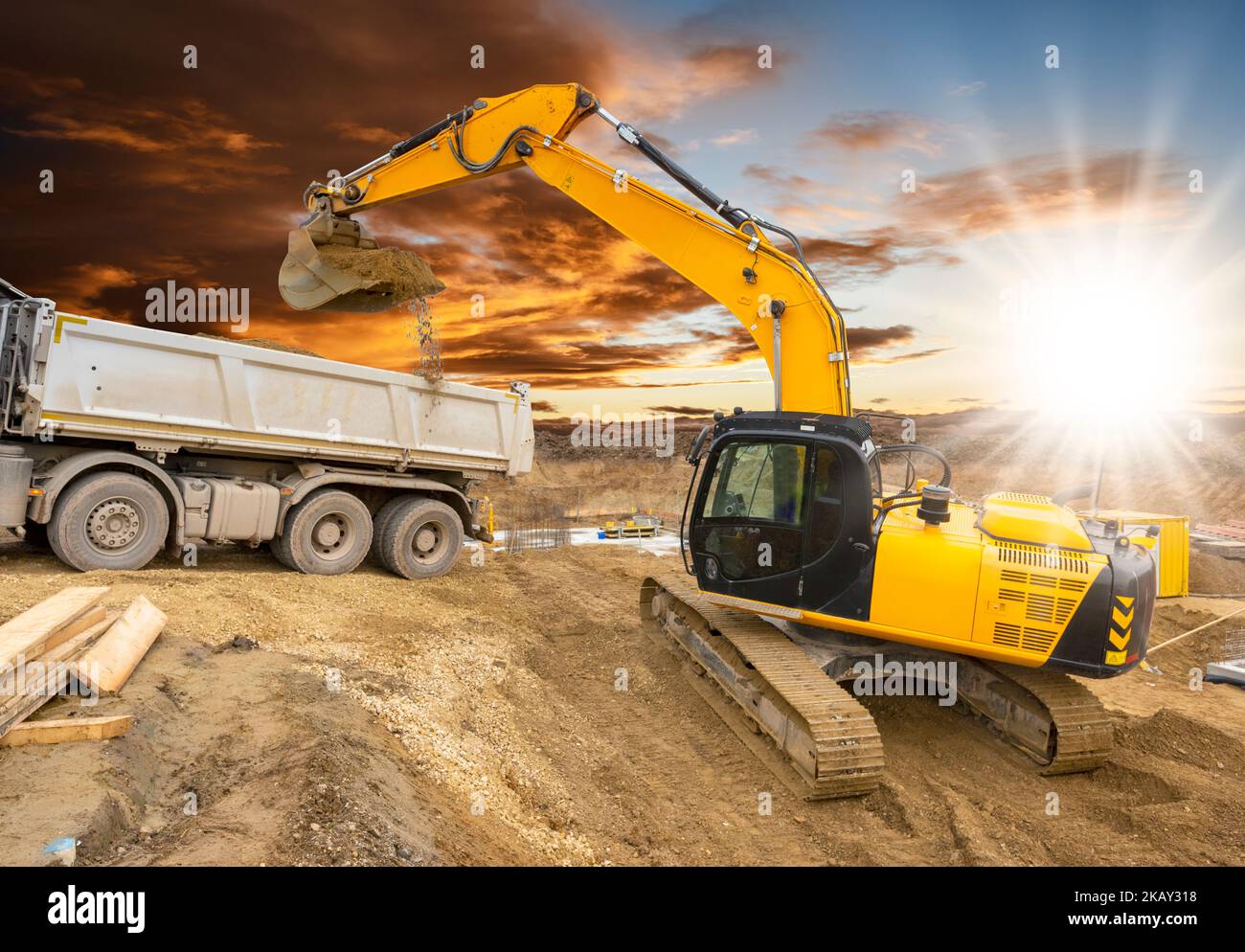 excavator is working and digging at construction site Stock Photo - Alamy