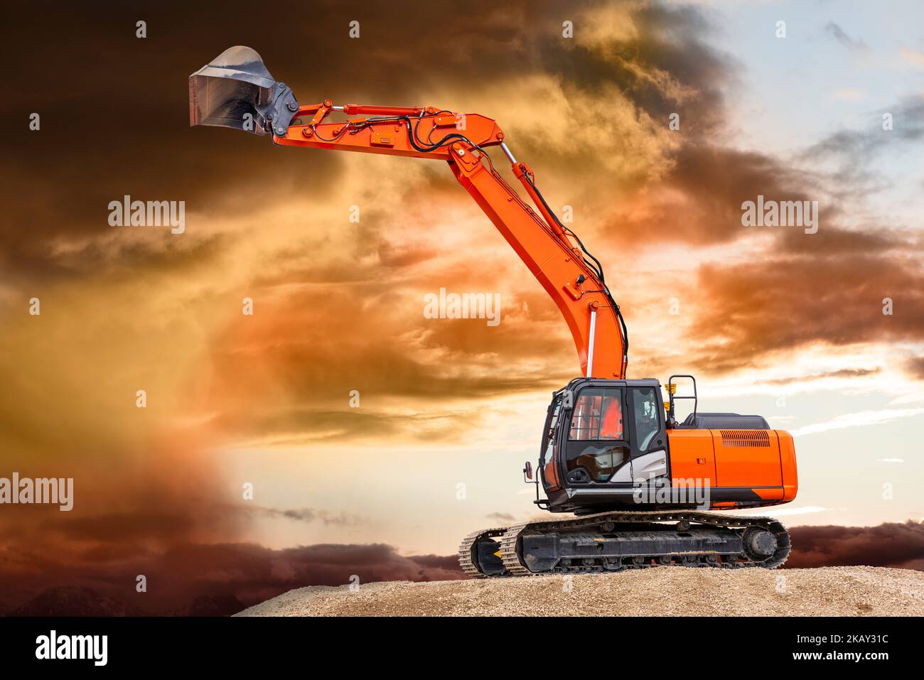 excavator is working and digging at construction site Stock Photo - Alamy