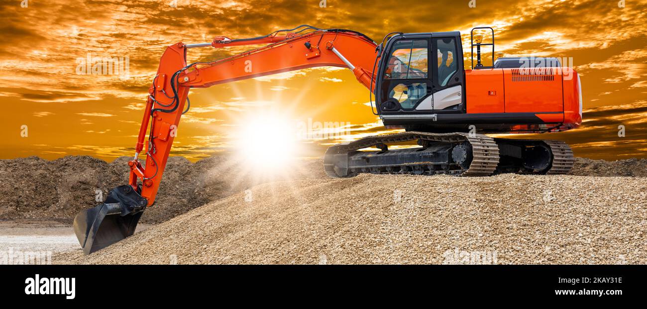 excavator is working and digging at construction site Stock Photo - Alamy