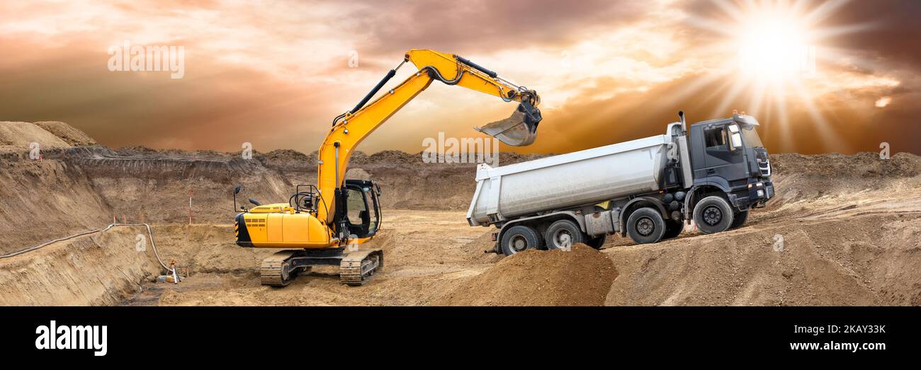 excavator is working and digging at construction site Stock Photo - Alamy