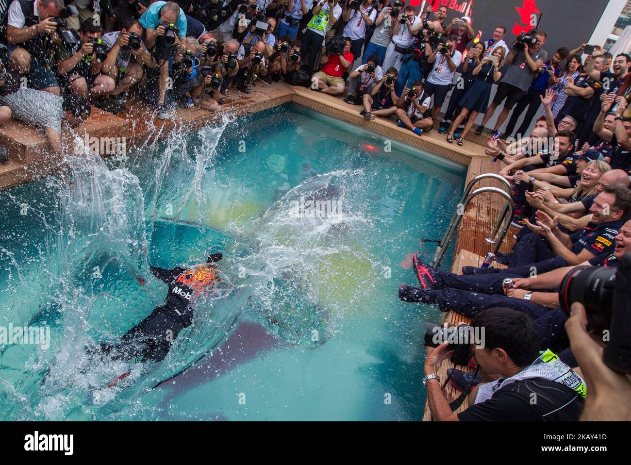 Daniel Ricciardo of Australia jumps into the pool at Red Bull energy ...