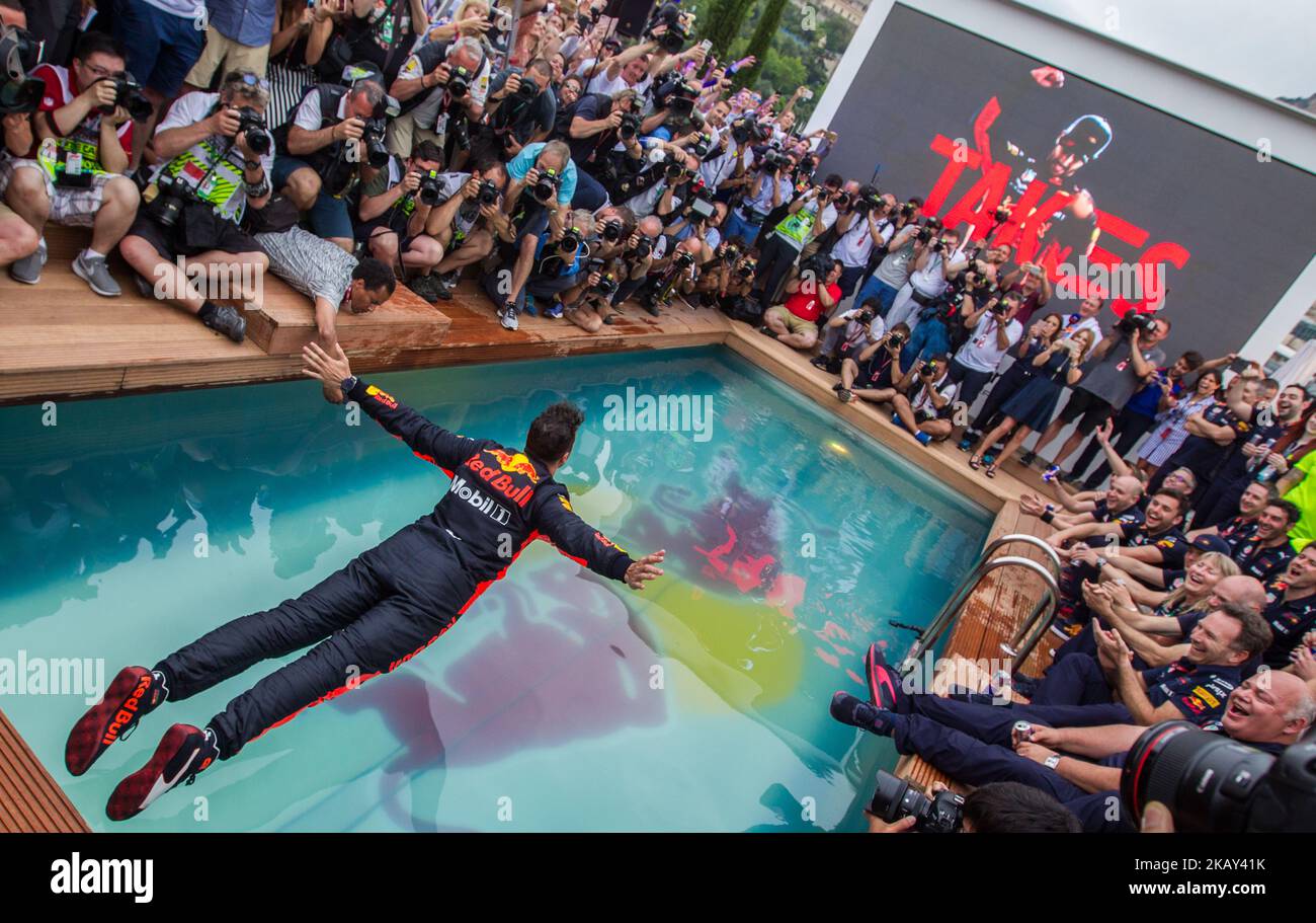 Daniel Ricciardo of Australia jumps into the pool at Red Bull energy ...