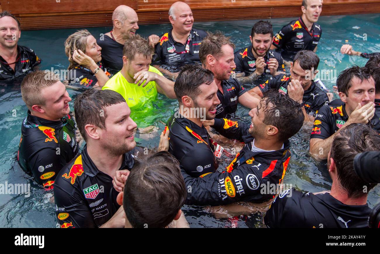 Daniel Ricciardo and Red Bull team members in the pool at Red Bull ...