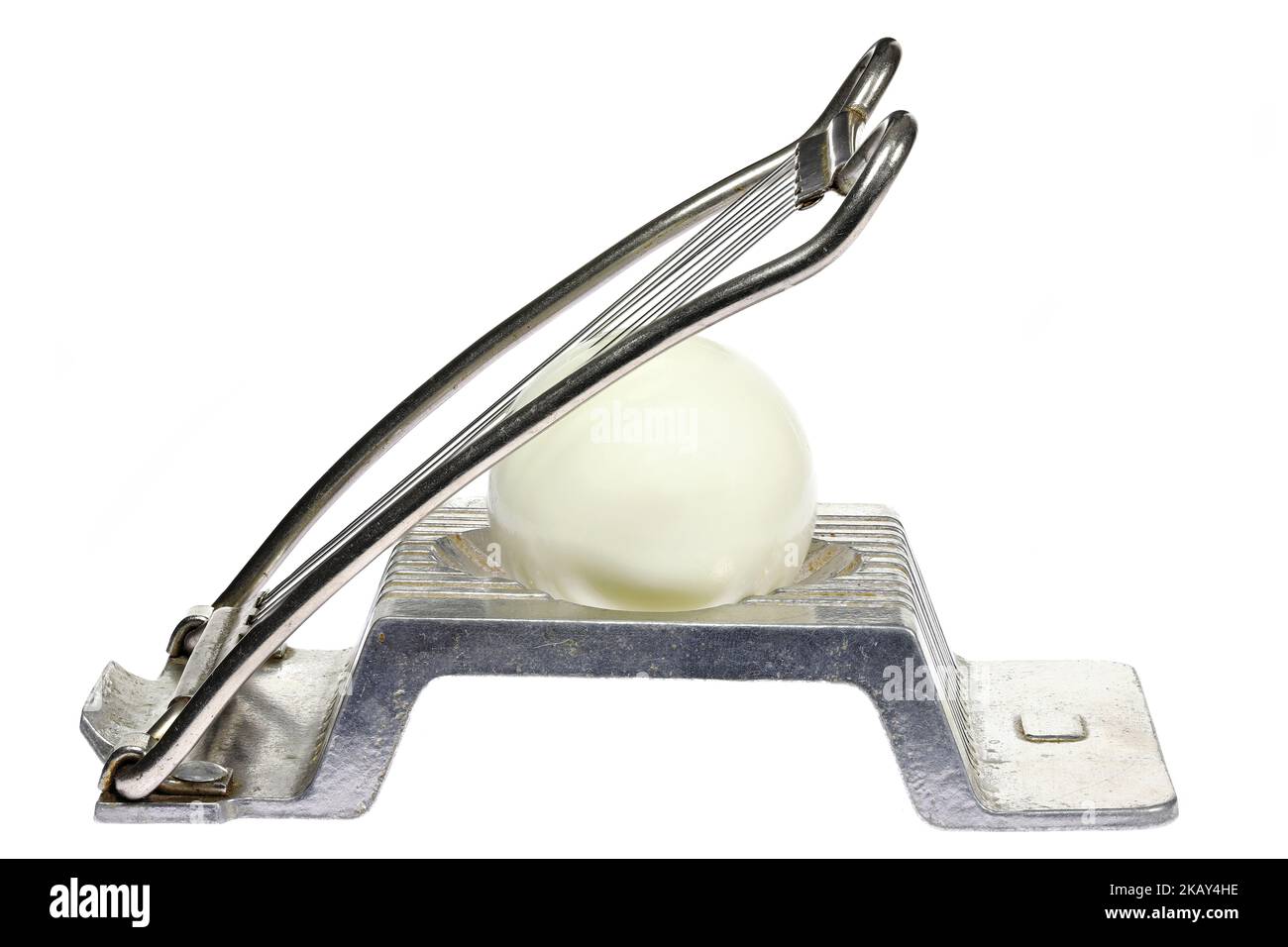 vintage aluminium egg slicer with hard-boiled chicken egg isolated on ...