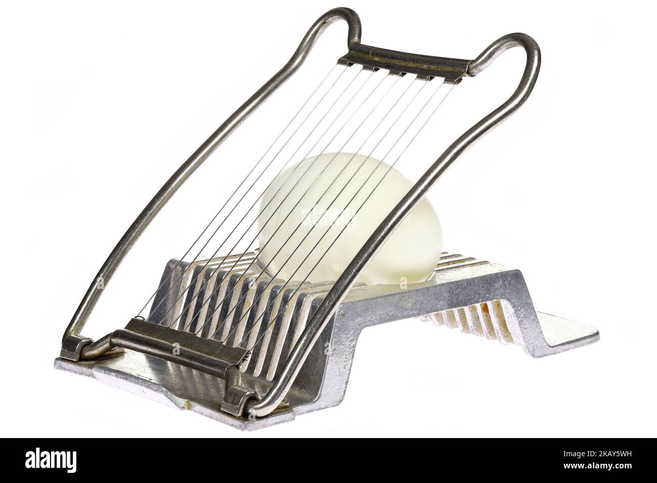 vintage aluminium egg slicer with hard-boiled chicken egg isolated on ...